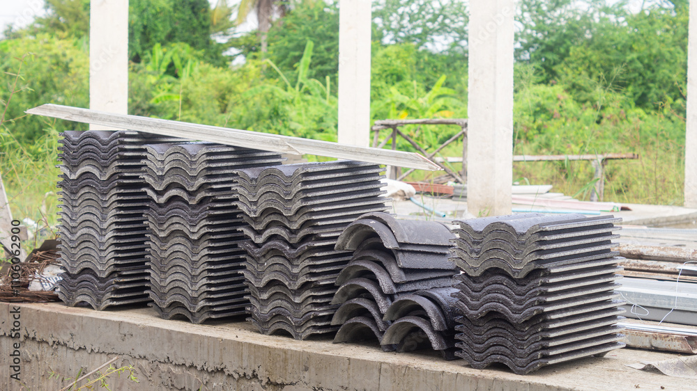 Roof tiles stacked on structural concrete floors, equipment for ...