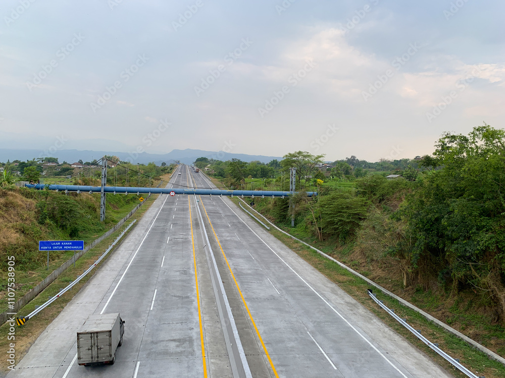 Photo & Art Print Scenic Highway View: A Long Stretch of Road Through ...