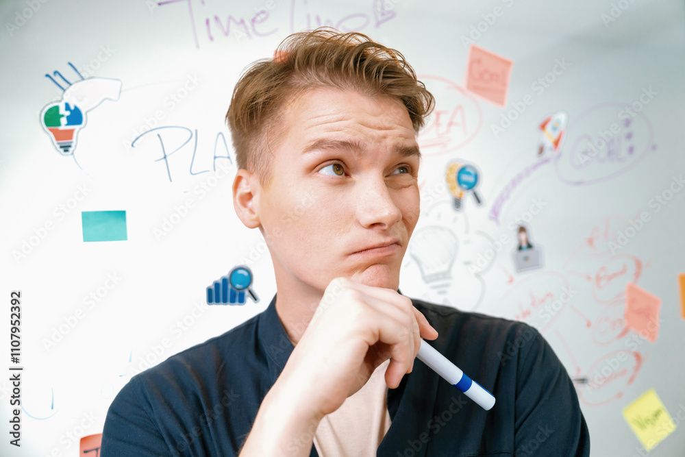 Portrait of young caucasian businessman thinking with confused face ...