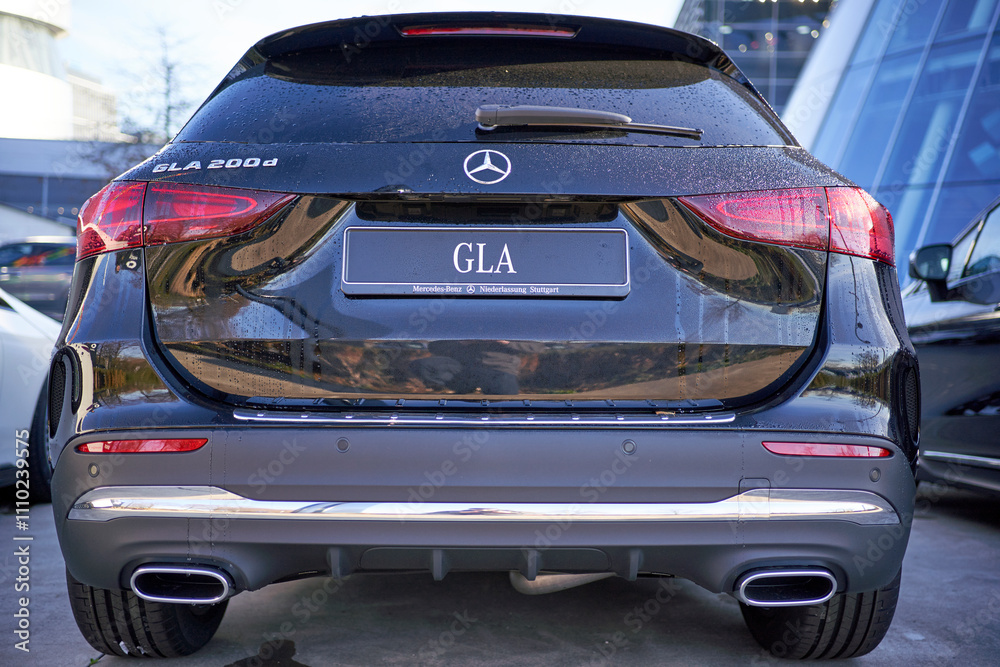 Rear view of a black Mercedes-Benz GLA 200d with shiny taillights and a ...