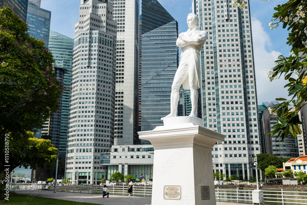 Singapore- July 17, 2024: Low-angle view of the statue of Sir Stamford ...