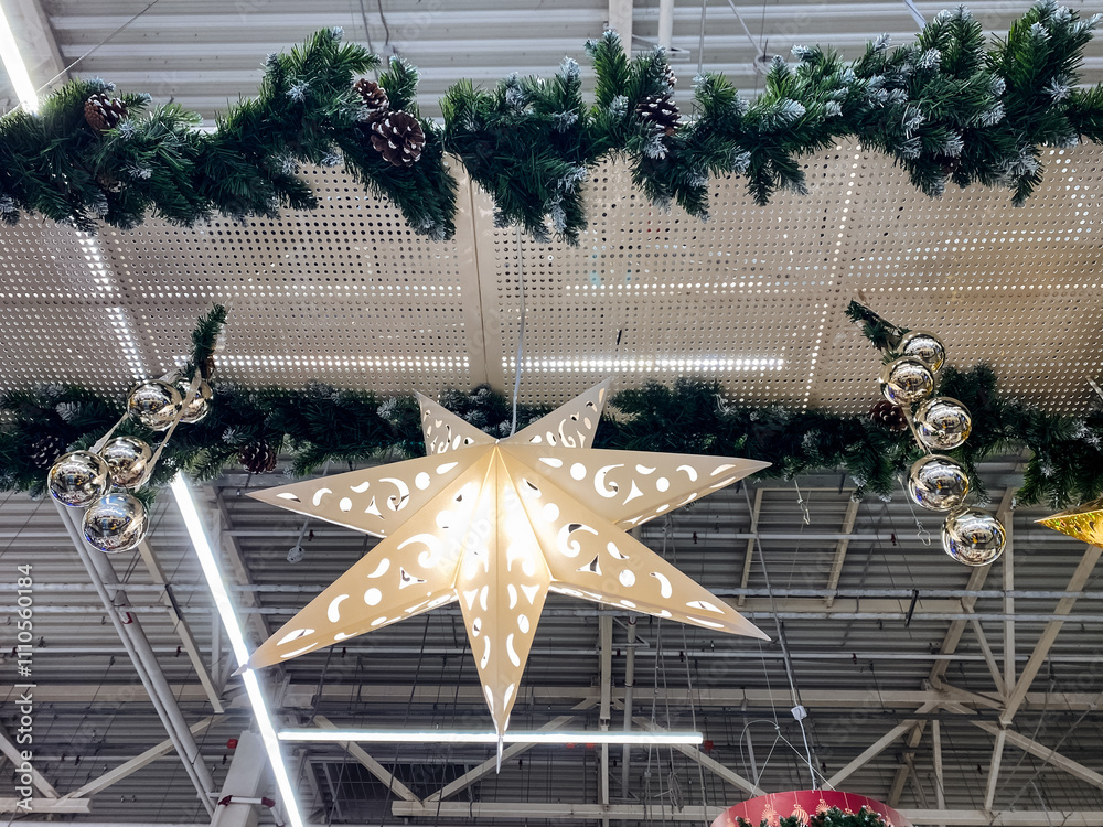 A breathtakingly beautiful Christmas star gracefully hangs from the ...