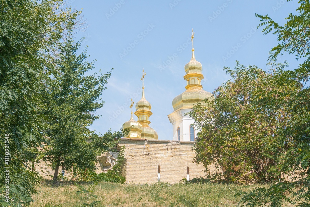 Image shows a large, ornate religious building with multiple domes and ...