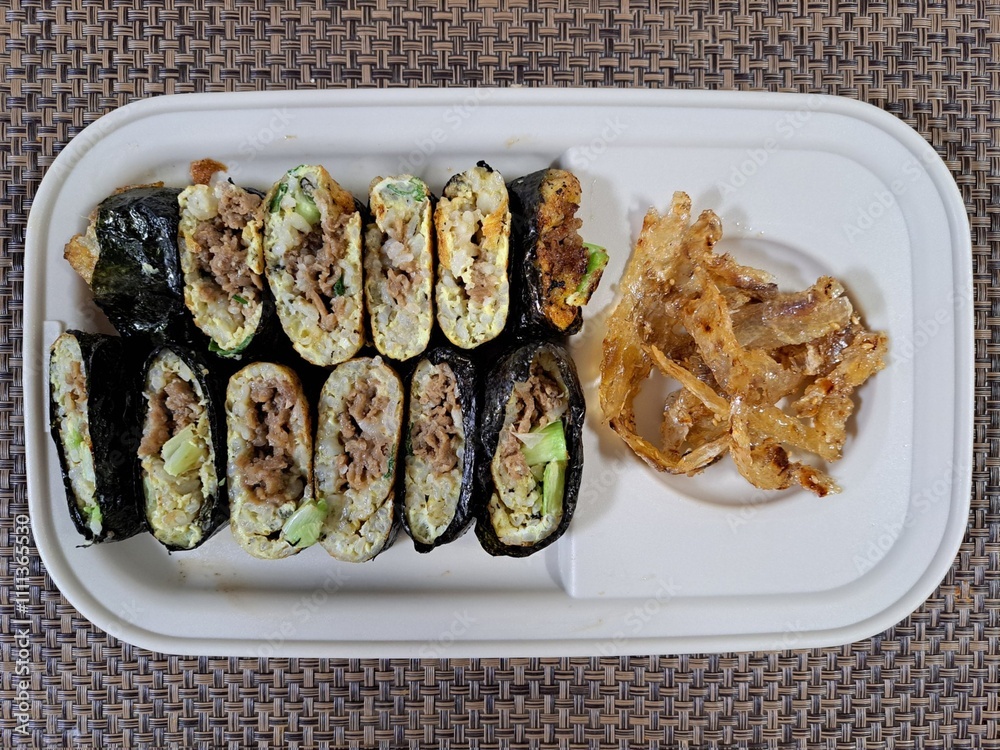 Delicious kimbap rolls filled with fresh vegetables, seasoned rice, and ...