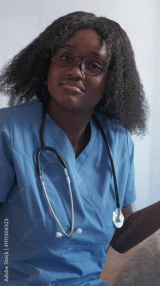 Vertical video. Confused doctor. Medical doubt. Unsure woman nurse in ...