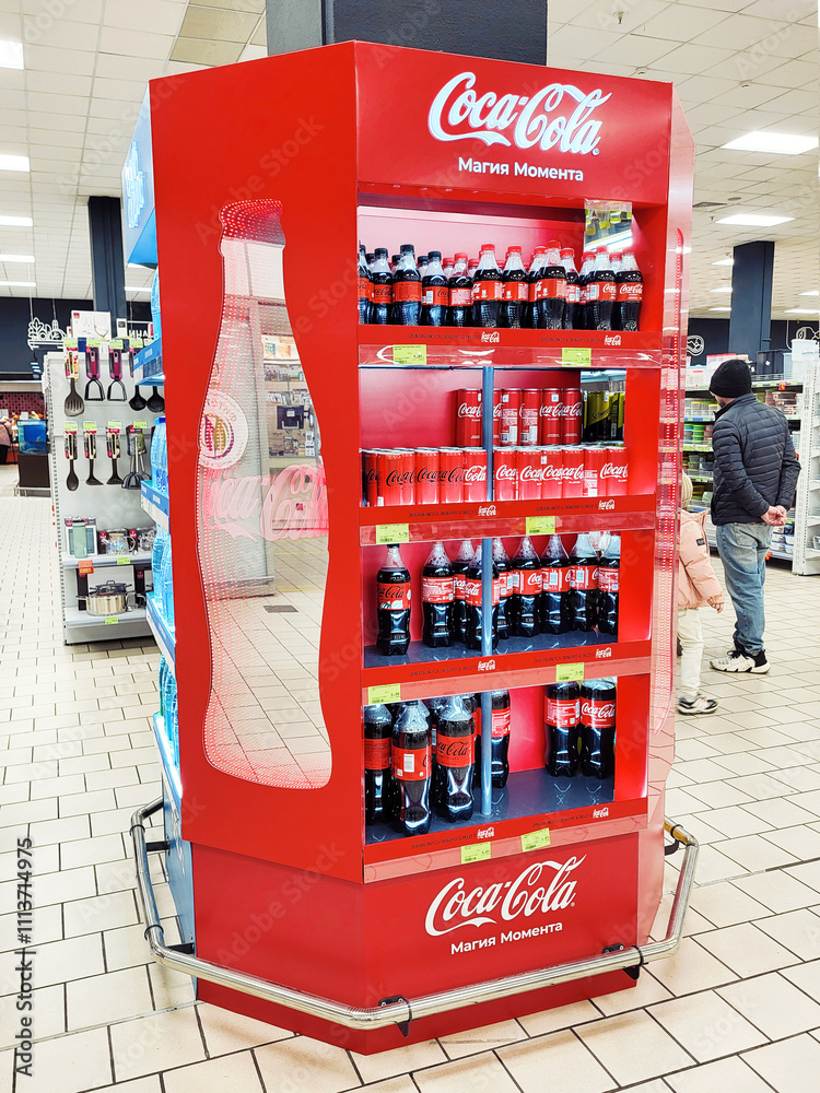 Minsk, Belarus. Nov 3, 2024. Coca Cola branded rack. Retail display stand featuring various ...