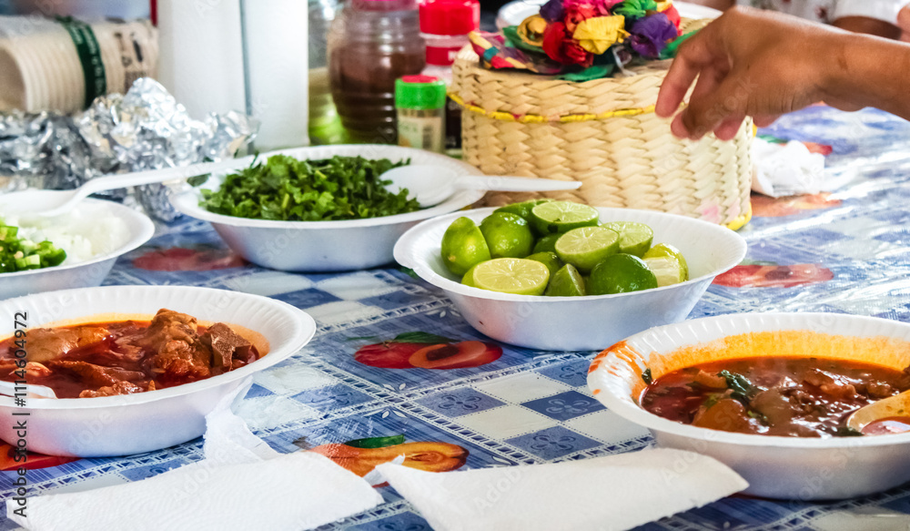 Poster Family reunion enjoying a traditional mexican dish called pork ...