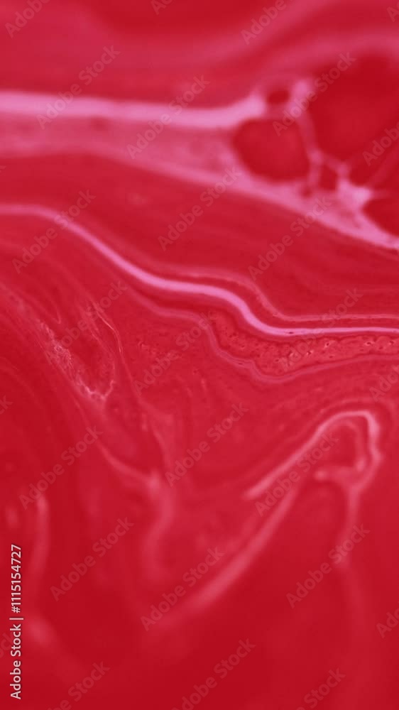 Vertical video. Ink fluid flow. Acrylic dye wave. Defocused red white ...