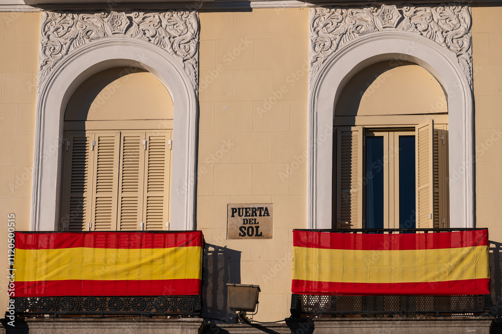 Spanish flags are placed at the balconies in Puerta del Sol, Madrid ...