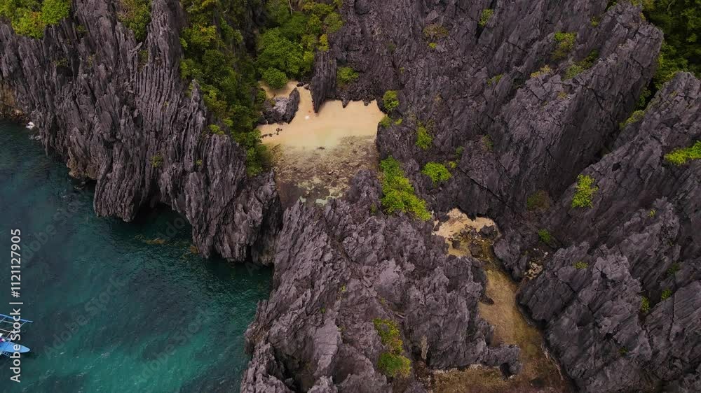 Secret Lagoon Surrounded By Towering Rock Formations In El Nido ...