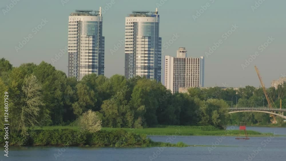 A breathtaking view showcases modern skyscrapers mirrored in the calm ...
