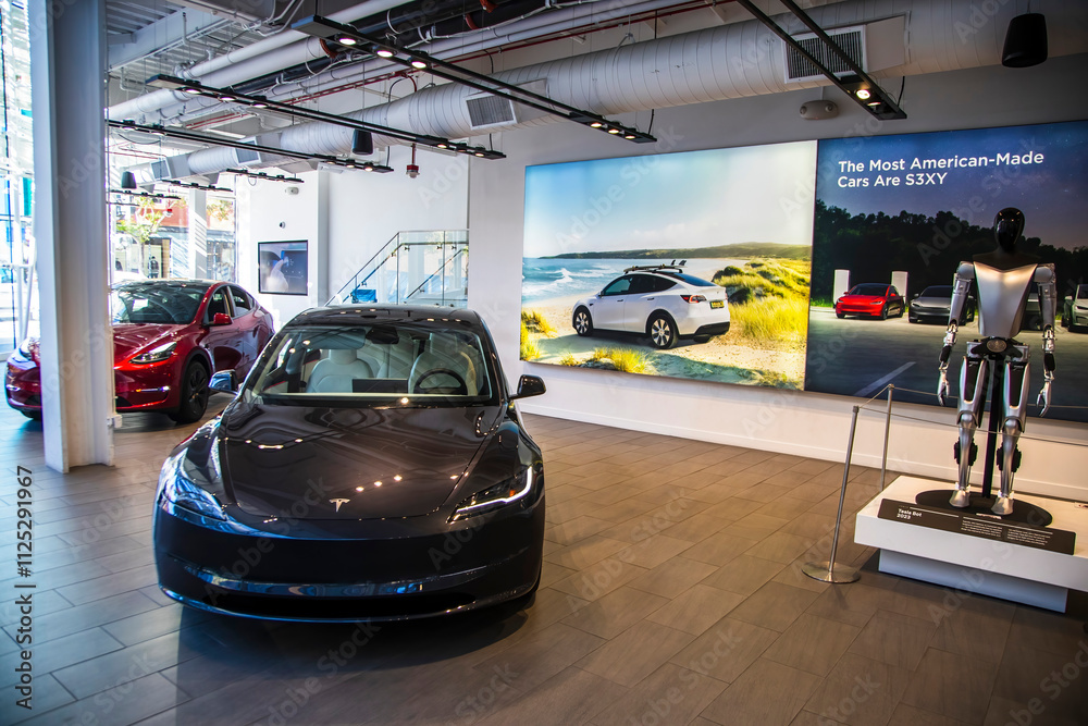 Tesla showroom interior featuring a display of Tesla models, including ...