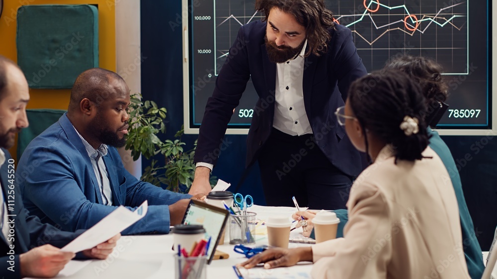 Startup team analyzing success metrics and key performance indicators ...