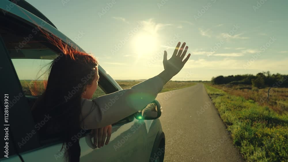 girl rides car with her hand out window, traveling together family ...