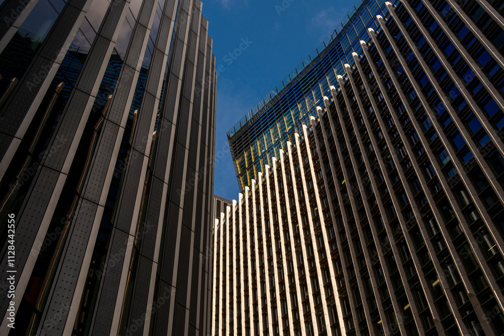 This image illustrates a striking pattern of modern buildings with ...