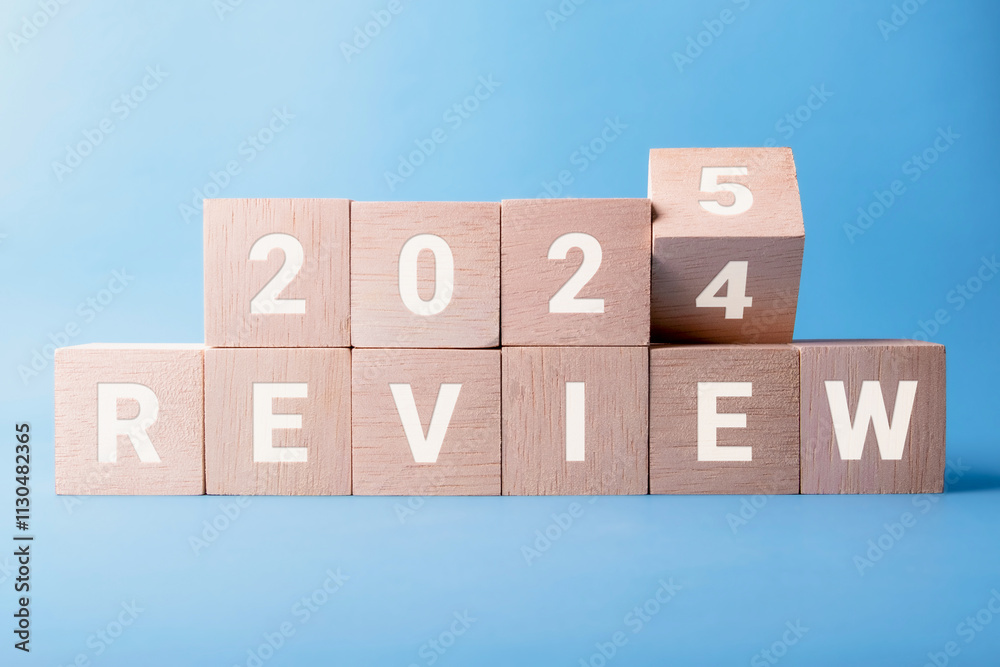 Planning 2025 review new year symbols. Concept words 2024 Review to 2025 Review on wooden blocks ...