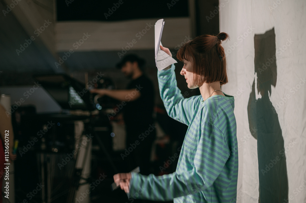 Director at work on the set. The director works with a group or with a ...