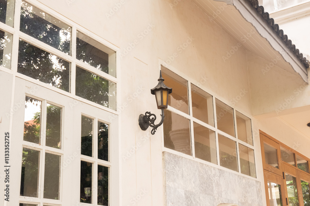 Cozy house exterior with wooden casement window and white wall ...