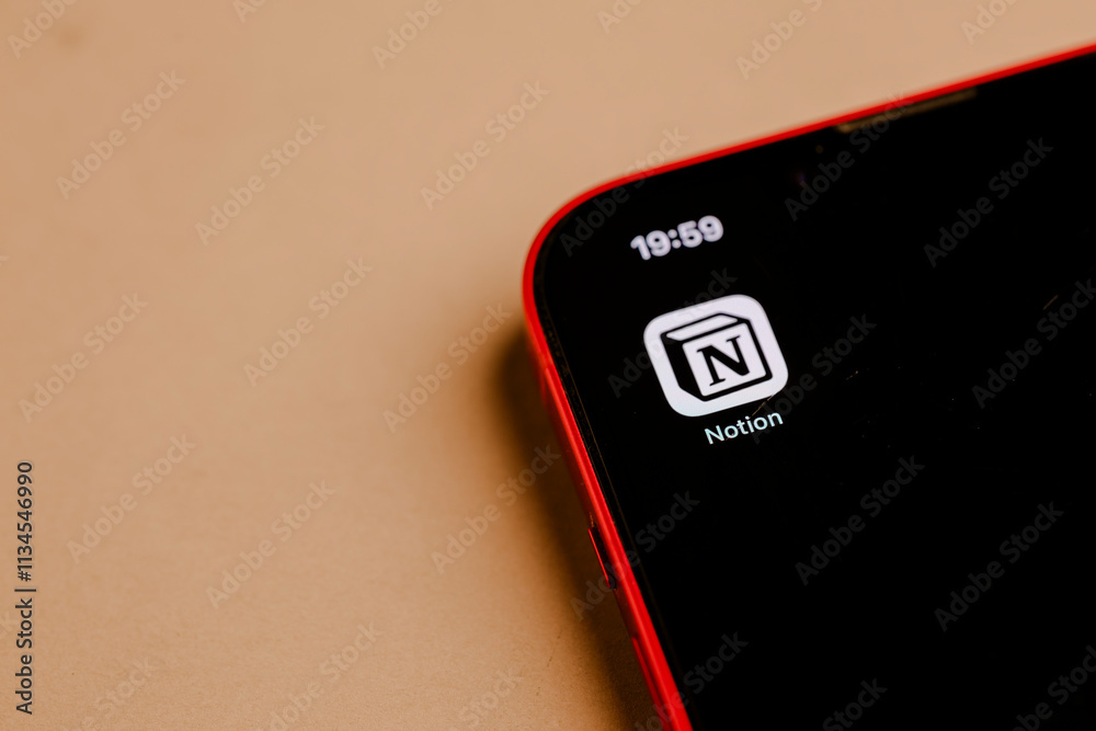 Notion app icon is seen on an iPhone. Notion is designed to be an ...