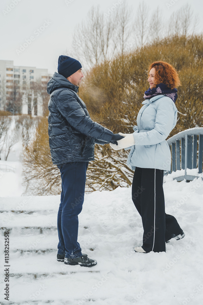 Love romantic love story. Happy couple of middle aged millennials, bright red-haired woman in ...