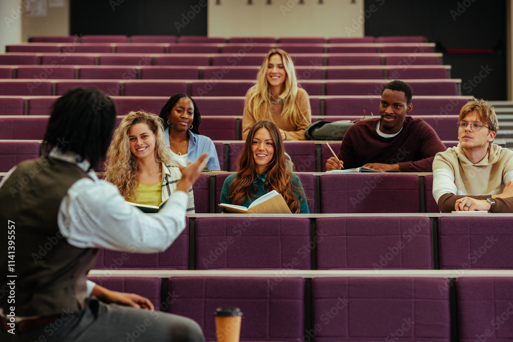 Professor engaging with students during university lecture in ...
