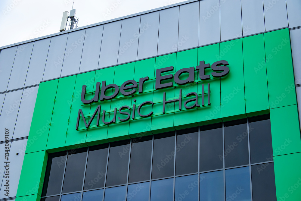 Uber Eats Music Hall Advertising logo on modern building facade, fusion ...