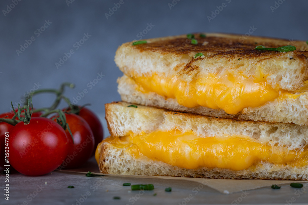 Grilled Cheese with melting cheese dripping from the inside. The ...