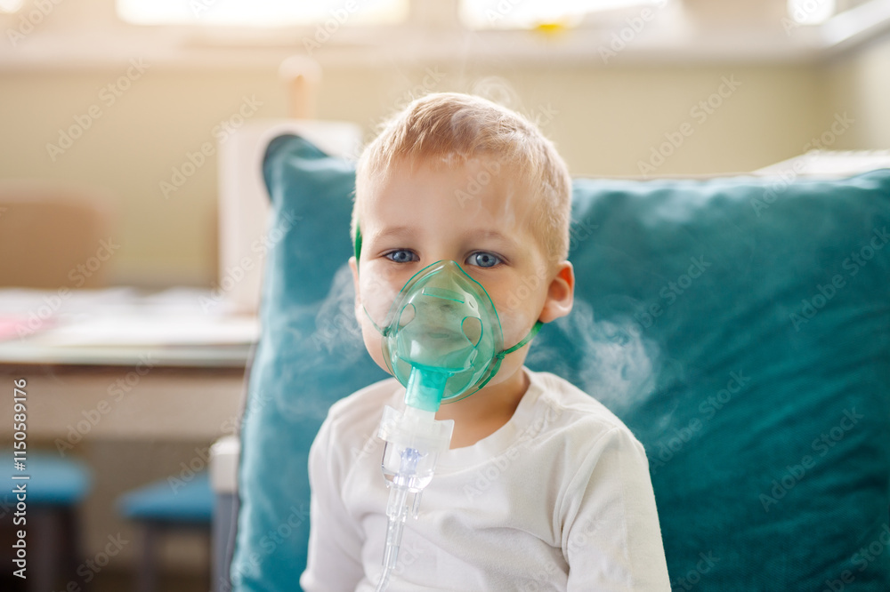 Cute little kid boy wear use medical nebulizer mask inhaling steam ...