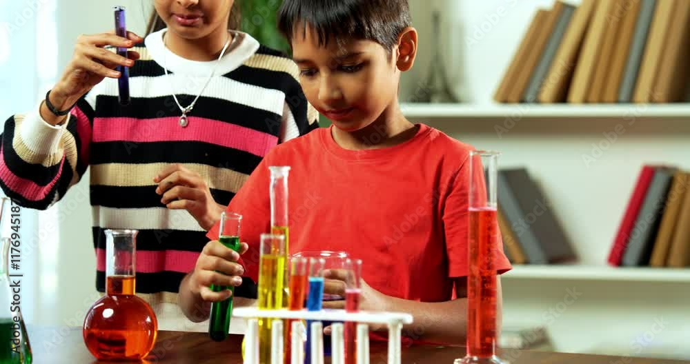 Indian Asian Curious Cute Little Girl and Boy Siblings Playfully Exploring Science Using ...