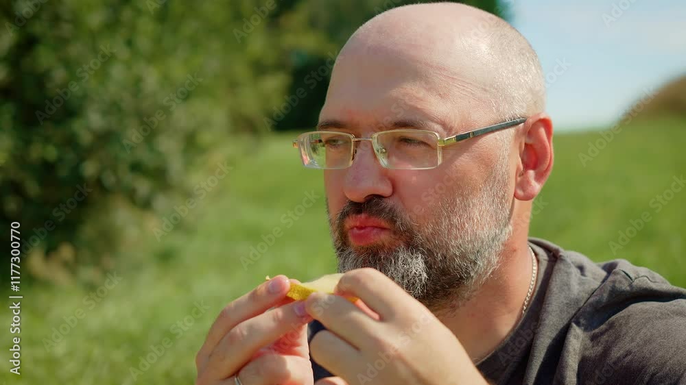 Bearded man eating sour lemon and reacting with puckered face. Male ...