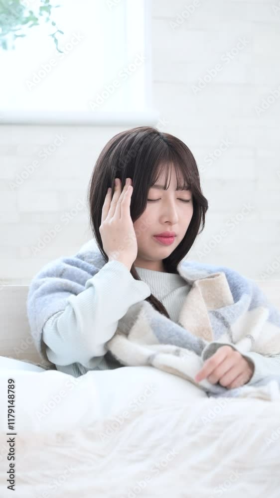 Vertical animation of a woman suffering from headache due to cold and ...