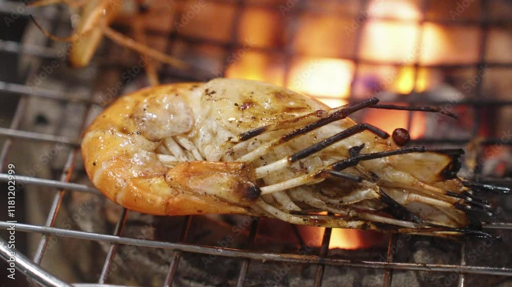 Stockvideon A plate of grilled shrimp and other seafood is being cooked ...