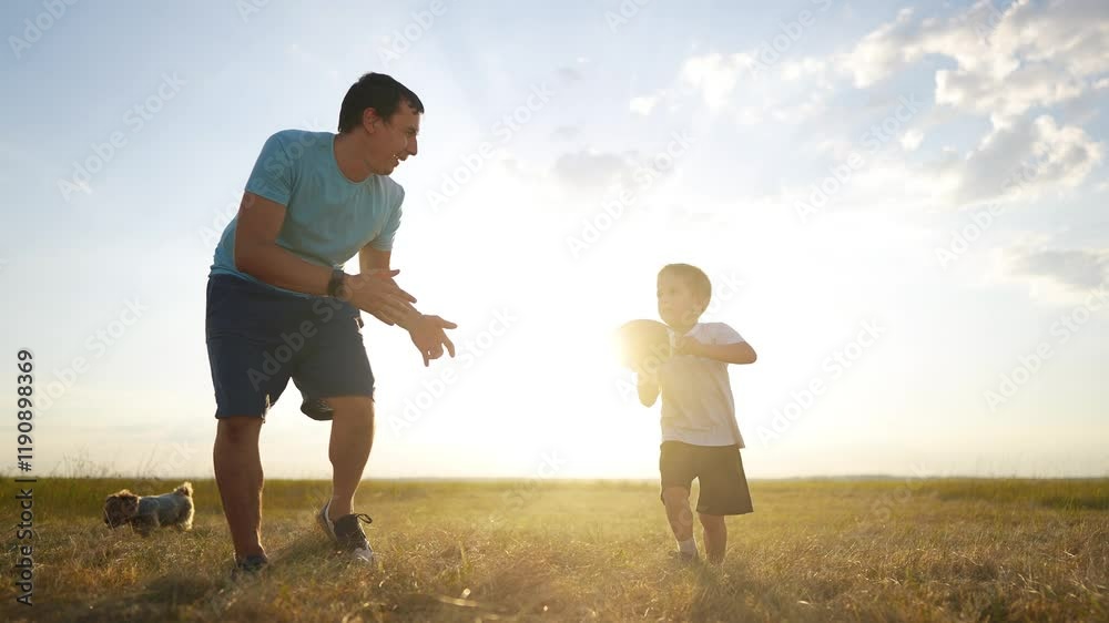 A father teaches his son to play football. Soccer child parent family ...