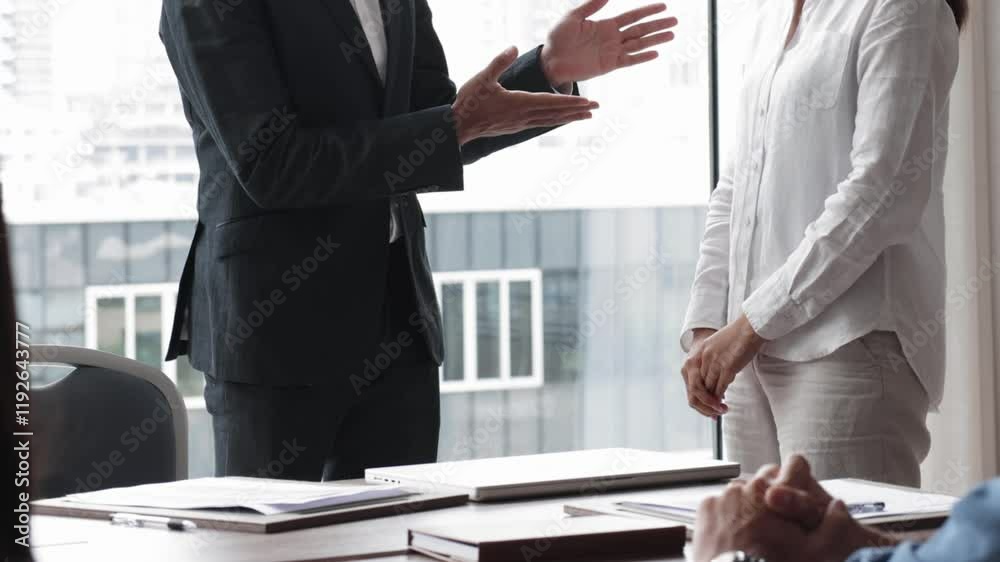 Boss handshaking introducing new employee, praising colleague for great ...