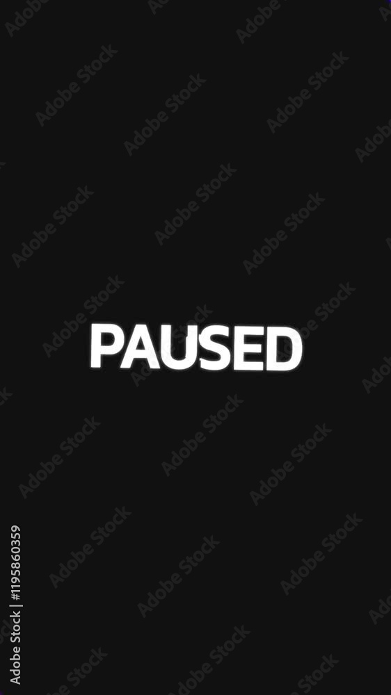 Looping vertical video with "PAUSED" text filling a black background ...