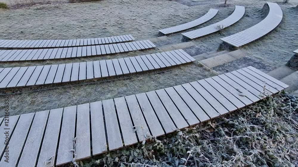 stone bench in the arch lined with wooden planks. outdoor theater ...