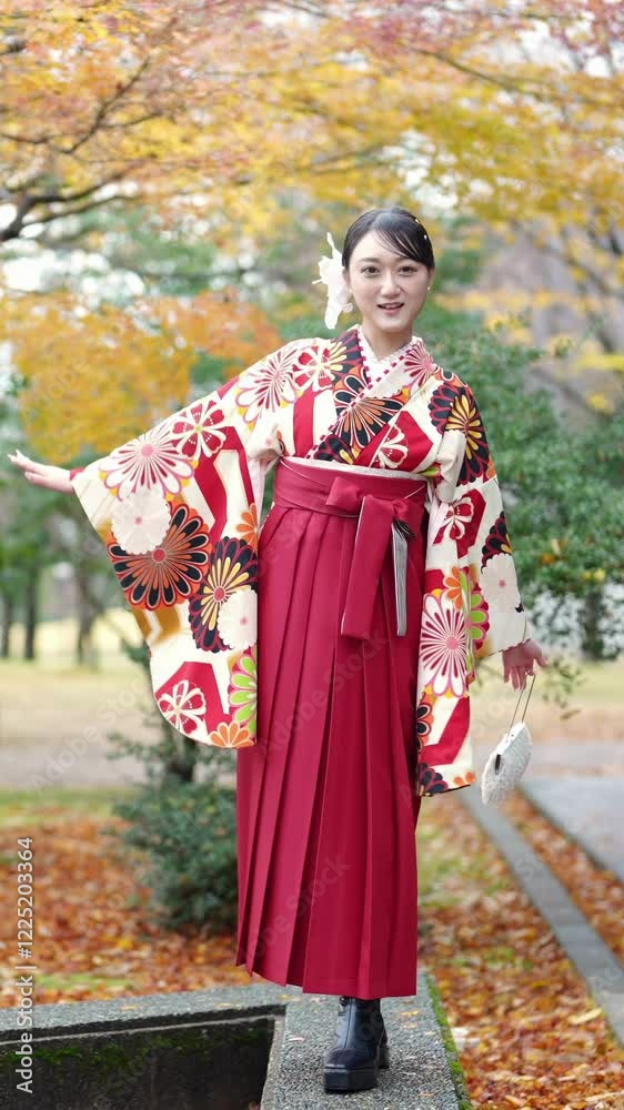 A young woman in her 20s wears a traditional graduation ceremony Hakama ...