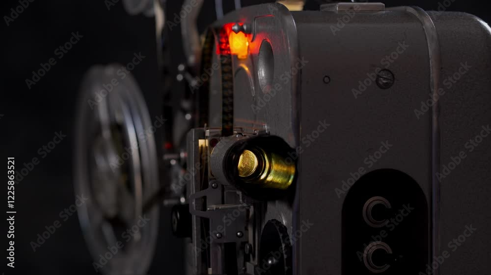 Working old-fashioned movie projector rotates in a dark room Stock ...