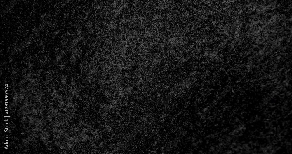 Dark Textured Surface with Subtle Motion. A close-up of a dark textured ...