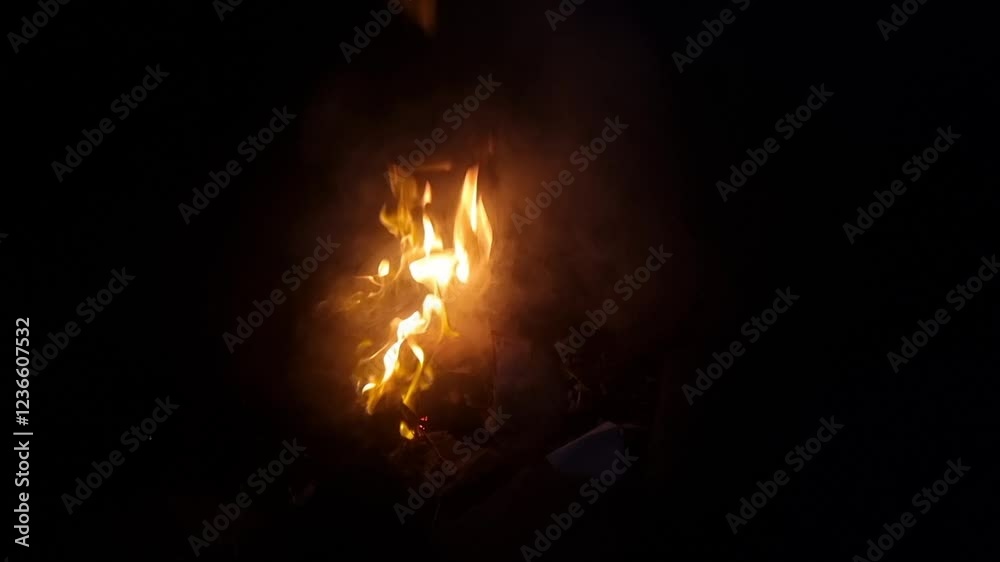 Waste burning with fire flames in the fireplace. Indian hindu festival ...