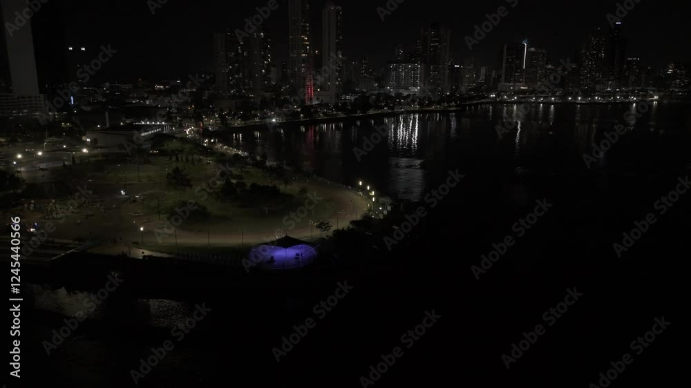 Drone orbits and descends on the Pacific Lookout at night in Panama ...