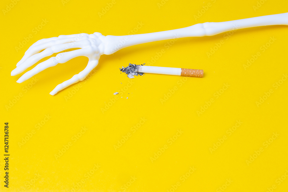Poster Hand of skeleton with burned cigarette and ash as a symbol of ...
