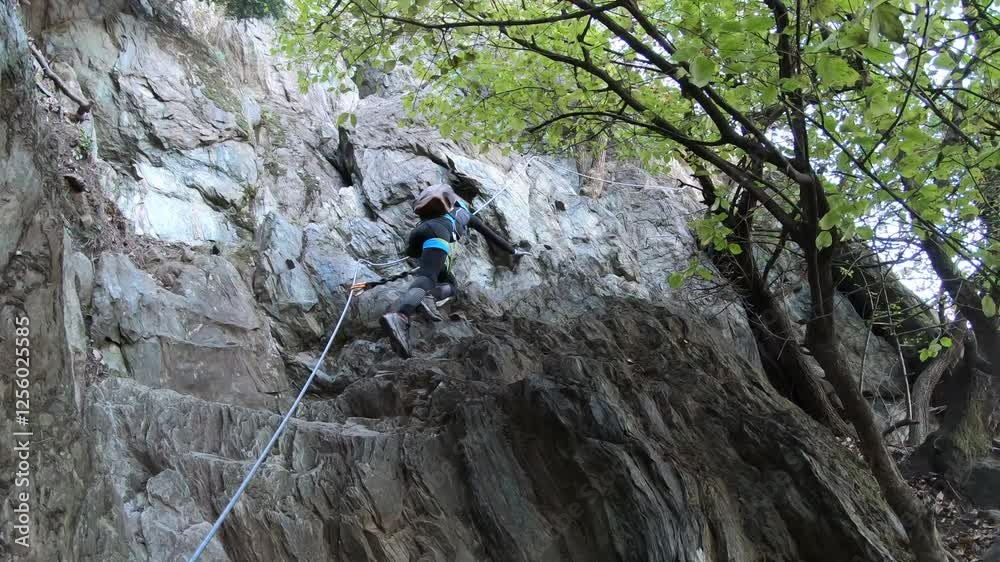 On Via Ferrata Sagra di San Michele, a climber navigates the iron rungs ...