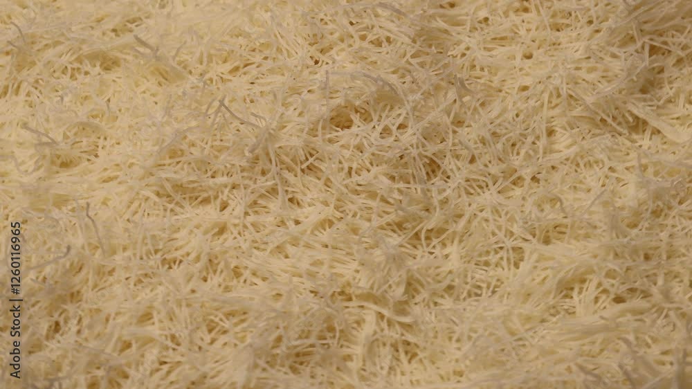 Kataifi dough, rotation in circle. shredded phyllo dough, Turning. Raw ...