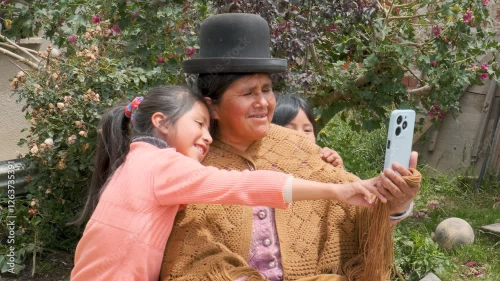 aymara cholita grandmother in pollera taking a selfie with her cell ...