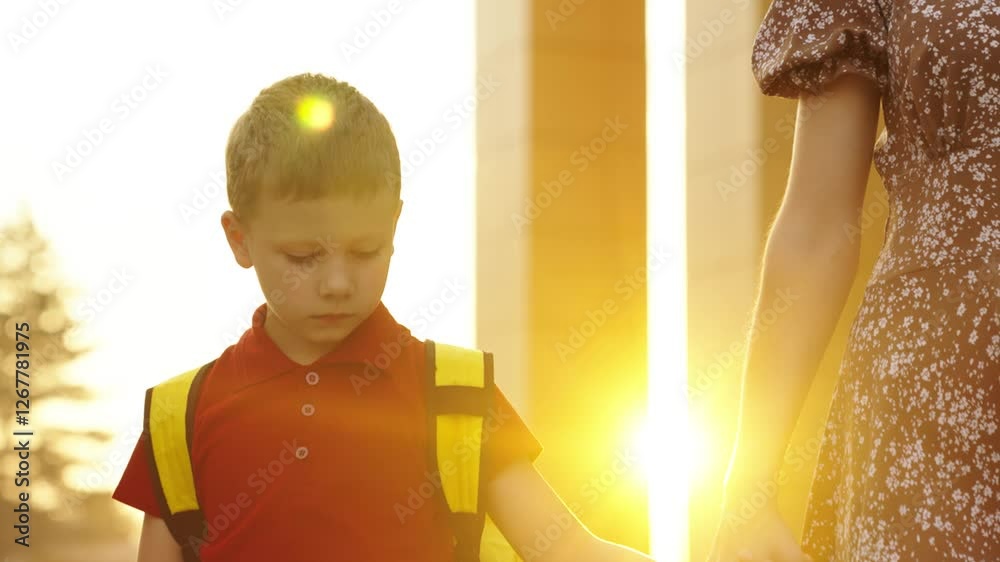 Child boy holding his mother's hand, boy son child schoolboy with a ...