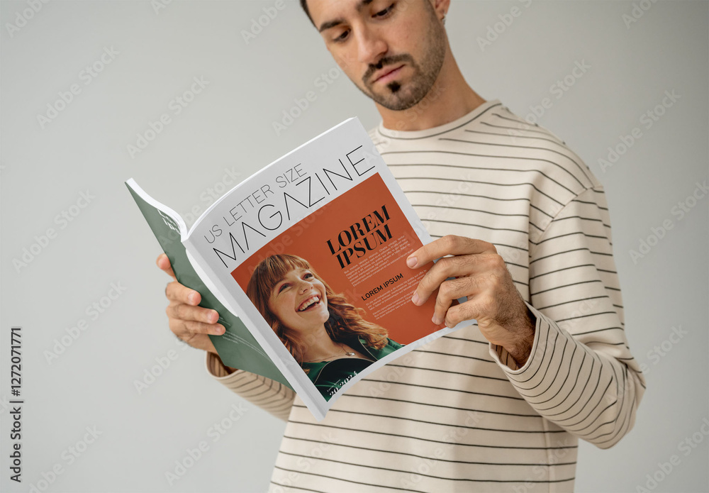 Mockup Of Man Reading Customizable Saddle Stitch Magazine Stock ...