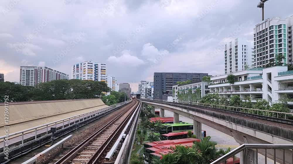 An SMRT train arrives at the Eunos MRT Station on the East-West line in ...