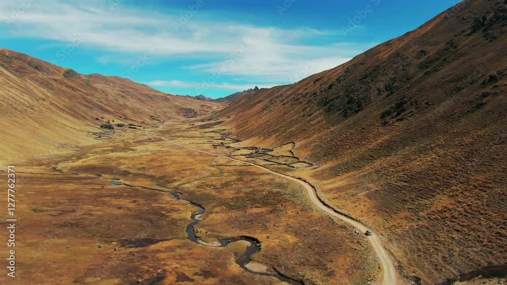 Panoramic aerial of Suytucocha river flowing in the Chaullacocha Valley ...