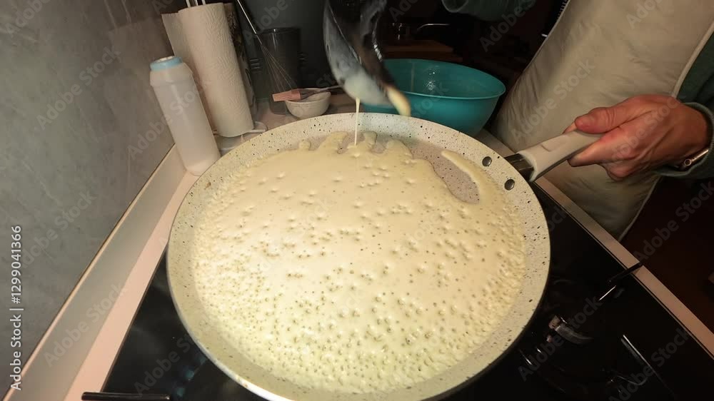 Woman Pouring Pancake Batter from a Ladle into a Nonstick Pan Tilted ...